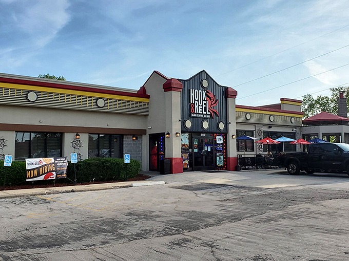 The nautical-themed exterior of Hook & Reel stands like a lighthouse for seafood lovers in landlocked Kansas, complete with those charming porthole windows.