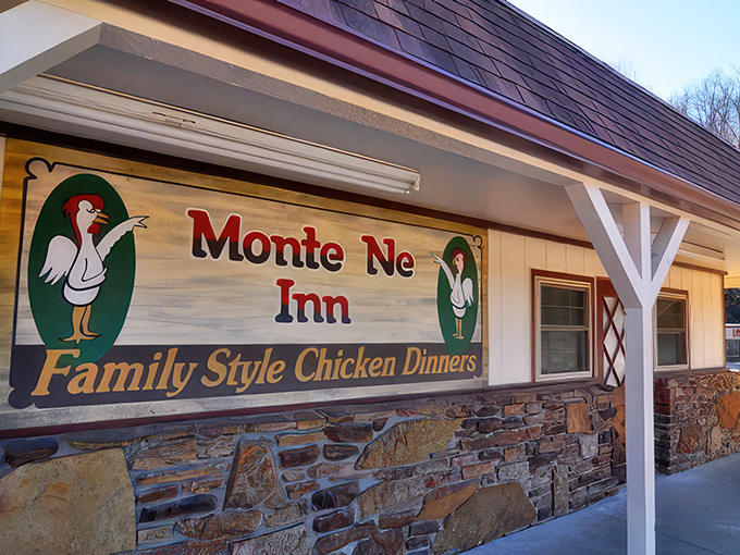 The iconic Monte Ne Inn sign promises "Family Style Chicken Dinners" with cartoon chickens that seem to know they're deliciously doomed. Arkansas comfort food at its finest.
