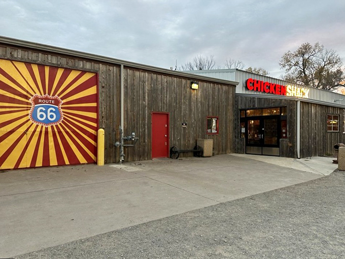 The unassuming exterior of Chicken Shack stands like a culinary lighthouse on Route 66, beckoning hungry travelers with its bold red-and-yellow sign.