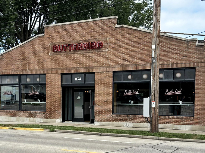 The glowing "BUTTERBIRD" sign against brick is Madison's bat signal for fried chicken enthusiasts. Simple, unassuming, and hiding delicious secrets within.
