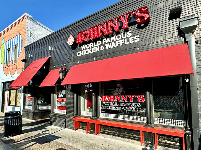 Johnny's bold red awnings and illuminated signage stand out like a beacon for hungry travelers. Southern hospitality begins at the curb.