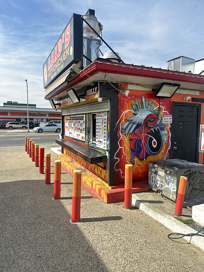Asad's vibrant exterior stands out like a spicy beacon of hope, complete with Philadelphia sports murals and those distinctive orange bollards guarding the perimeter.