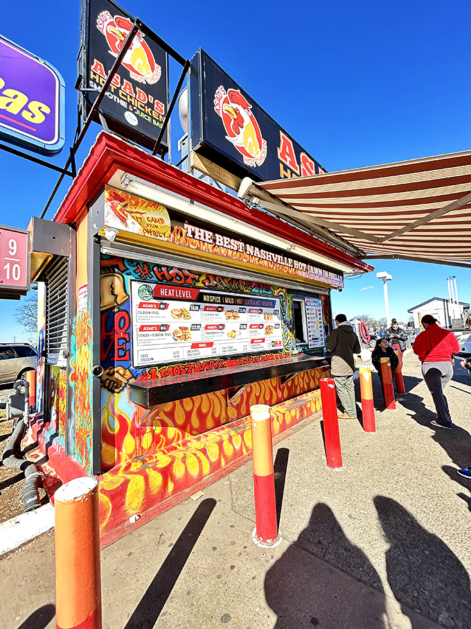 Asad's vibrant exterior stands out like a spicy beacon of hope, complete with Philadelphia sports murals and those distinctive orange bollards guarding the perimeter.