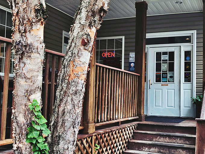 The unassuming entrance to culinary paradise. Those birch trees aren't just decoration—they're sentinels guarding Chapel Hill's best-kept secret.