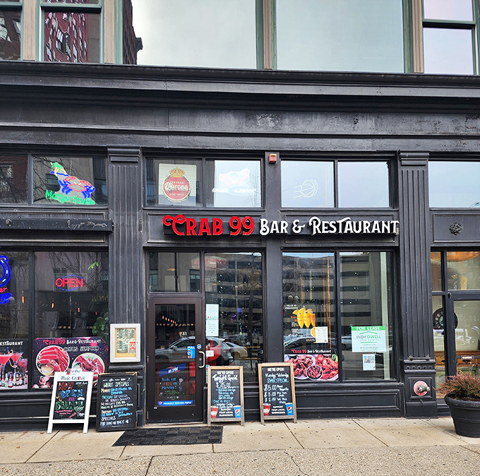 The neon glow of Crab 99's sign cuts through the night like a lighthouse for seafood-starved Midwesterners, promising oceanic treasures in downtown Indy.