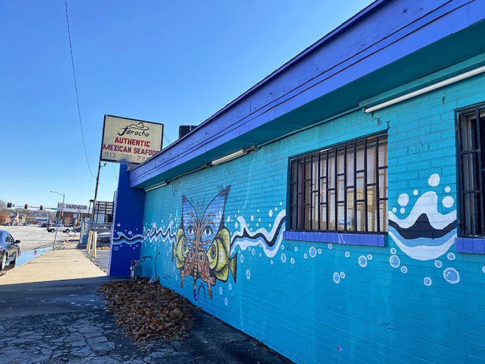 The turquoise building with its playful octopus mural stands like a colorful mirage in Kansas City, promising seafood treasures within.