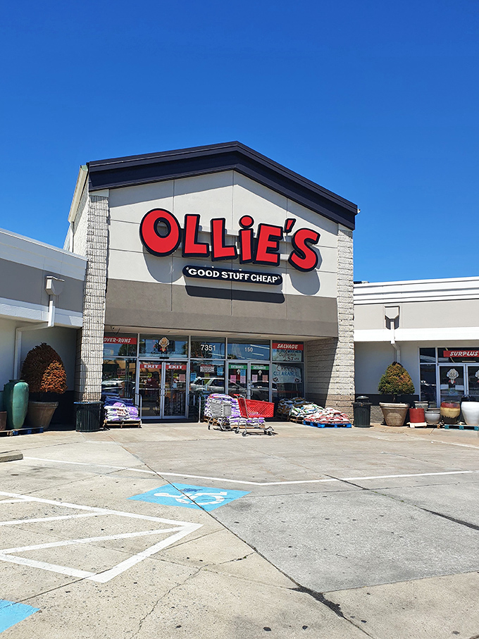 The iconic red Ollie's sign promises "GOOD STUFF CHEAP" – a siren call to bargain hunters that's impossible to resist.