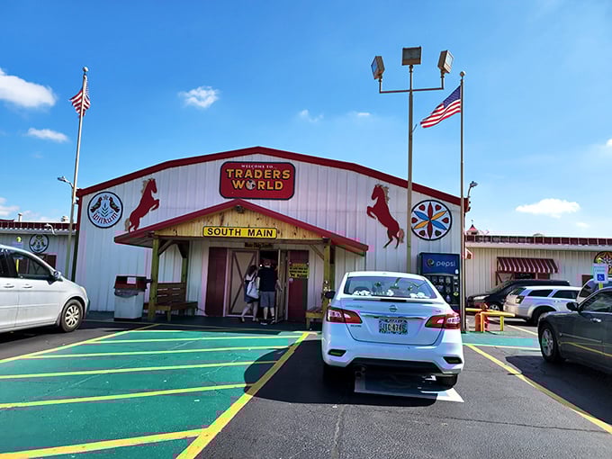 The iconic red and white entrance to Traders World beckons with its horse silhouettes and American flags&mdash;like the pearly gates of bargain heaven.