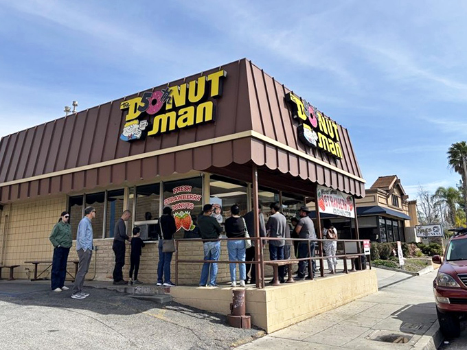 The brown building with the iconic yellow sign has become a Route 66 landmark. Like a donut beacon in the night, it calls to hungry travelers.