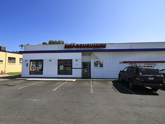 The unassuming white building with its bold red sign promises what lies within: donut perfection without pretension. Simplicity at its finest.