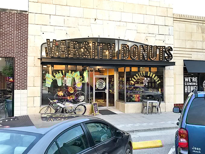 The marquee-style sign at Varsity Donuts lights up Aggieville like a Broadway show where the starring role goes to fried dough and happiness.