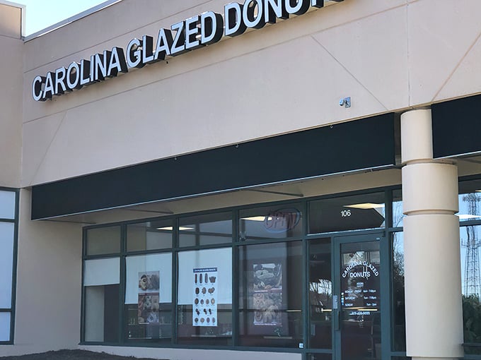 The unassuming storefront holds sweet treasures within. Like finding a $20 bill in old jeans, Carolina Glazed Donuts delivers unexpected joy.
