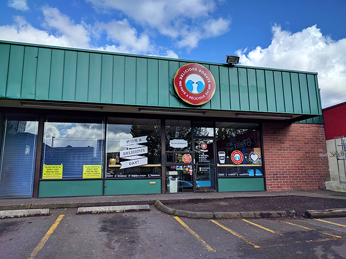 The unassuming green storefront of Delicious Donuts stands like a beacon of hope for carb enthusiasts. Portland's best-kept secret hides in plain sight. 