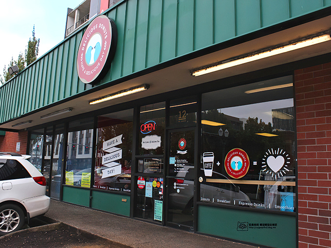The unassuming green storefront of Delicious Donuts stands like a beacon of hope for carb enthusiasts. Portland's best-kept secret hides in plain sight. 