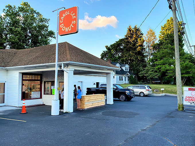 The iconic orange sign beckons like a sunrise, promising sweet salvation to early risers and donut devotees alike. A Blacksburg landmark that's worth every calorie.