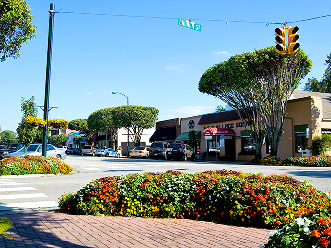 Fairhope's iconic downtown clock stands like a cheerful timekeeper, reminding visitors they've entered a place where minutes pass a little more sweetly.