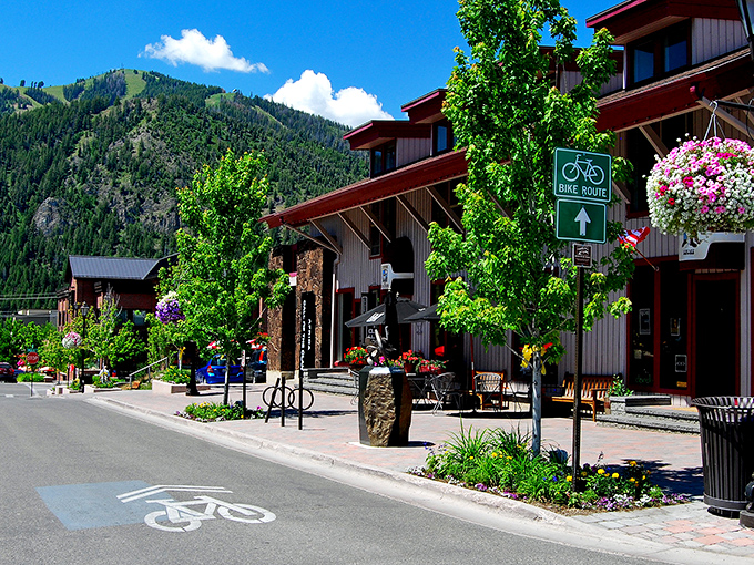 Historic brick buildings line Ketchum's charming streets, where spring blossoms frame architecture that whispers stories of Idaho's mining past.