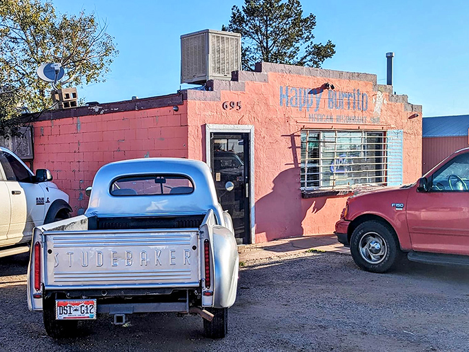 The pink adobe exterior of Happy Burrito stands out like a desert mirage, complete with vintage Studebaker that's as classic as their recipes.