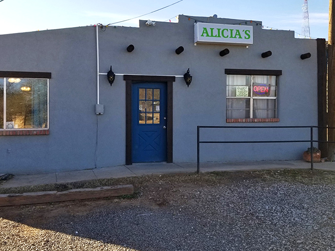 The unassuming exterior of Alicia's might fool you, but that blue door is basically a portal to flavor country. No fancy frills needed.