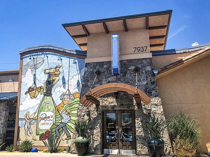 Pismo's terra cotta exterior with distinctive blue awnings stands like a coastal mirage in Fresno's urban landscape. Beach vibes without the sand in your shoes!
