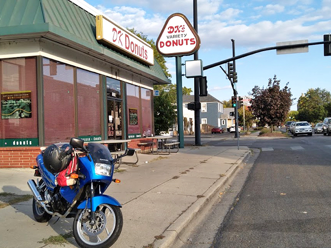 The green-roofed temple of fried dough stands like a beacon on State Street, promising sweet salvation to all who enter.