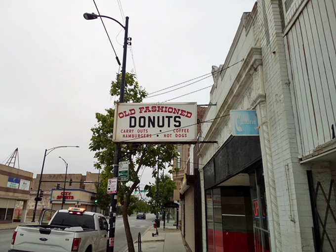 The unassuming white storefront with its vintage sign promises simple pleasures that fancy downtown bakeries can only dream of replicating.