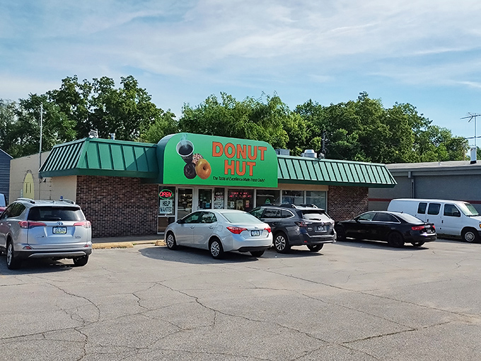 The unmistakable green awning of Donut Hut stands as a beacon of breakfast bliss in Des Moines, promising sweet salvation to early risers and sugar enthusiasts alike.