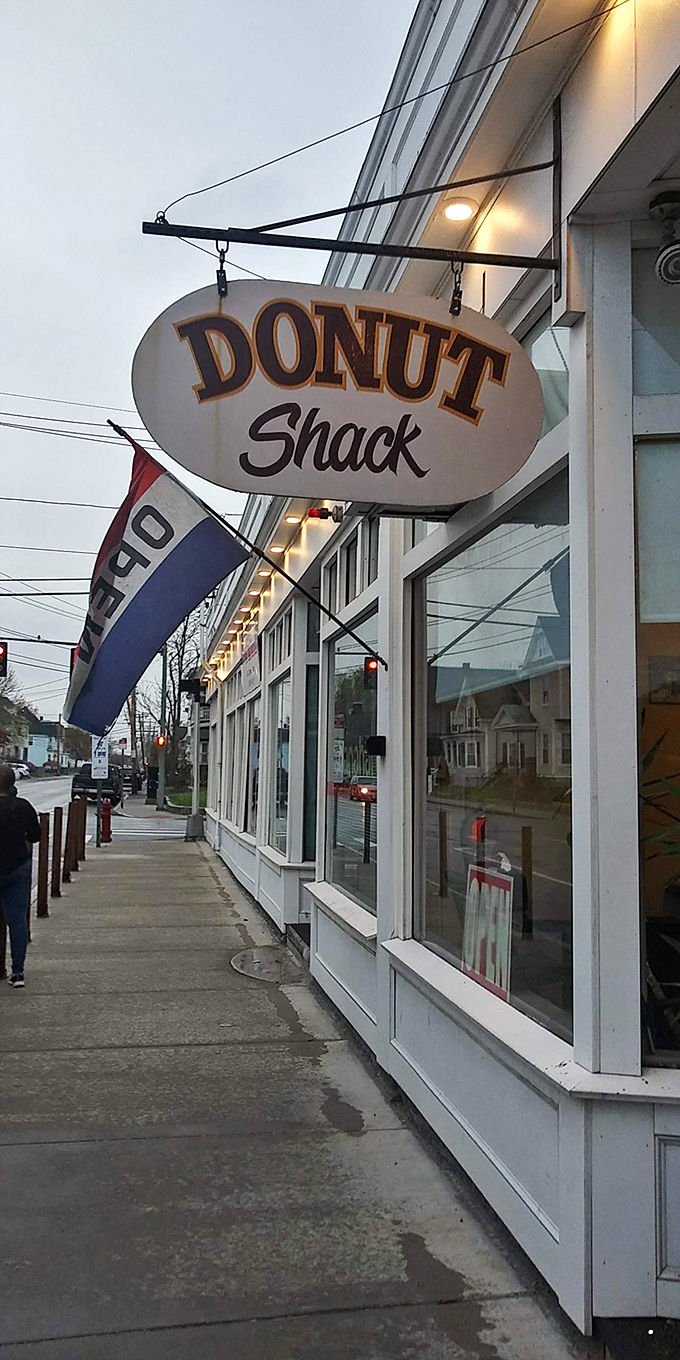 The classic barber pole and vintage sign beckon like an old friend. This modest storefront in Lowell hides donut treasures better than any fancy bakery could dream of. 