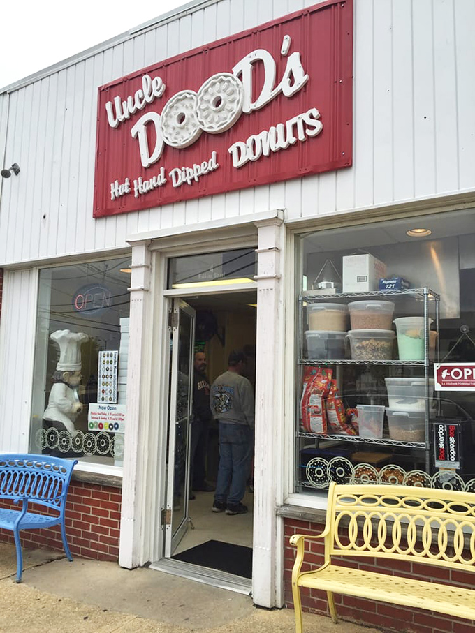 The iconic red and white sign promises "Hot. Hand. Dipped. Donuts." &mdash; four words that might be the sweetest poetry ever written on a storefront.