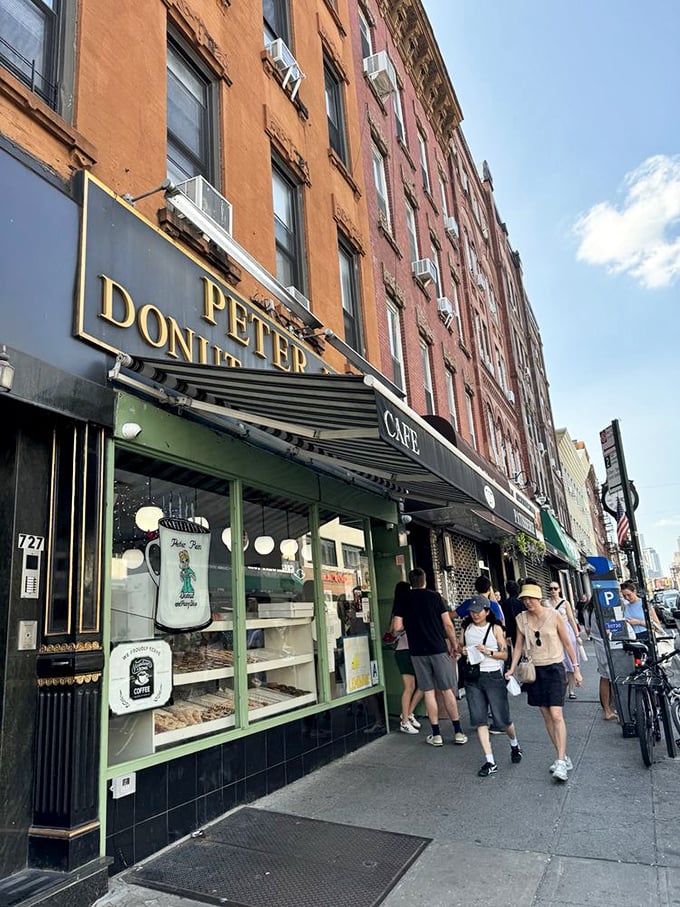 The storefront with gold lettering beckons like a sugar-coated lighthouse on Manhattan Avenue. Donut paradise awaits.