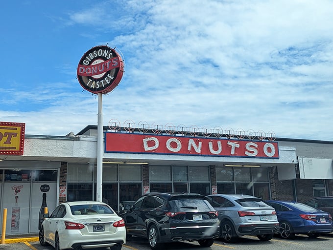The iconic Gibson's Donuts storefront stands proudly against Memphis' skyline, a beacon of fried dough perfection for early risers and night owls alike.