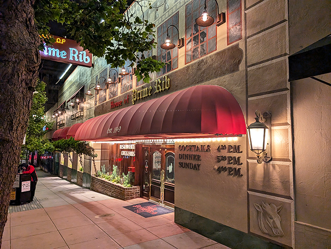 The iconic red awning beckons meat lovers like a carnivorous lighthouse on Van Ness Avenue, promising beef-filled dreams since 1949.