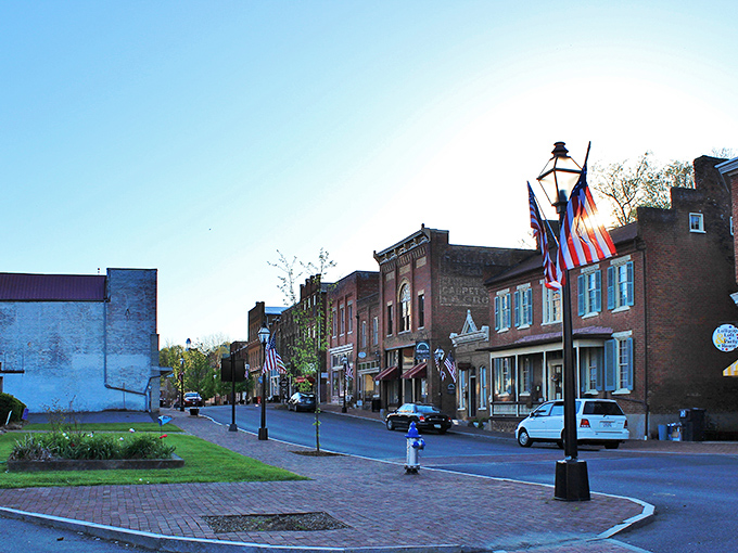 Main Street Jonesborough whispers stories from 1779, where brick sidewalks and American flags create a Norman Rockwell painting come to life.