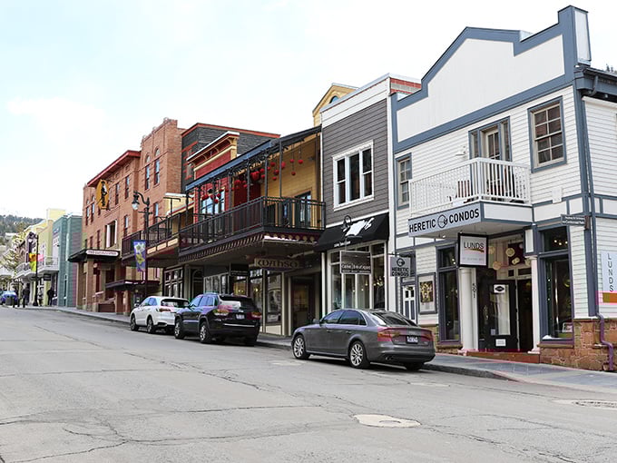 Park City transforms into a winter wonderland at dusk, where historic buildings glow with warmth against the snow-covered mountains. Pure magic!