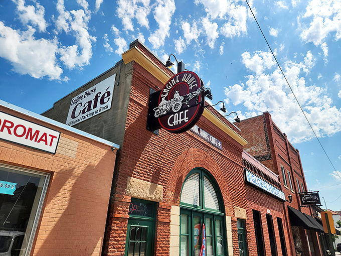 The historic brick facade of Engine House Cafe stands proudly against Nebraska's big sky, a beacon for breakfast enthusiasts and history buffs alike. 