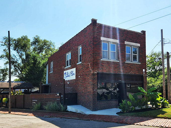 From the outside, The Blue Palm plays it cool &ndash; a modest brick building that keeps its tropical treasures hidden like a speakeasy with sunscreen.