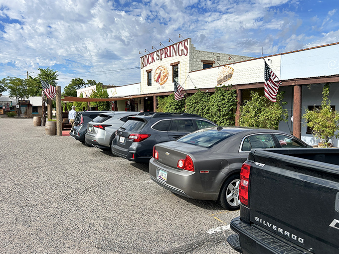 The iconic white facade of Rock Springs Caf&eacute; stands proudly against the Arizona sky, with that painted pie slice practically winking at hungry travelers on I-17.