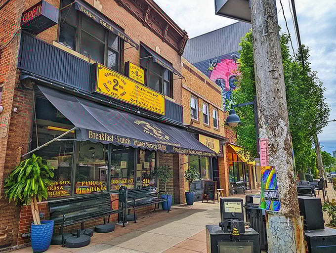 The iconic yellow awning of Hamburg Inn No. 2 beckons like a culinary lighthouse on Linn Street, promising comfort food that's stood the test of time since 1948.