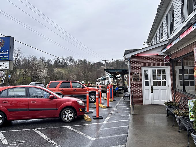 Even on a rainy day, Baugher's welcomes hungry travelers with its charming entrance and colorful parking bollards &ndash; a roadside beacon of comfort food paradise.