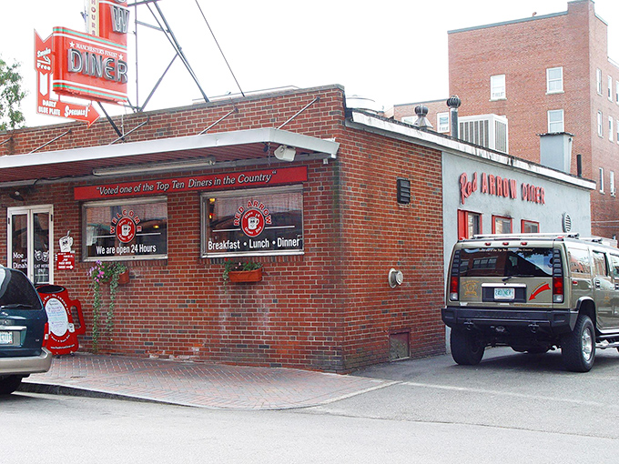 That iconic red arrow sign has been beckoning hungry travelers to this Manchester landmark since 1922, a neon North Star guiding food pilgrims home.
