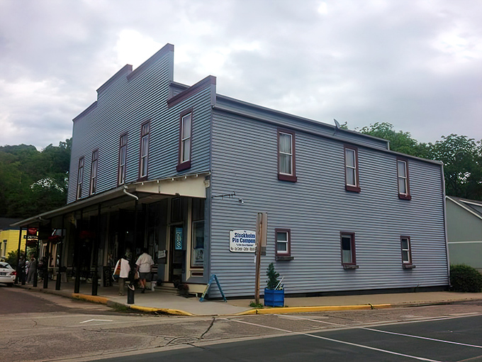 This isn't just a storefront&mdash;it's a siren call to pie lovers everywhere. The classic white clapboard with cheery yellow bunting practically whispers, "Come inside, calories don't count in Stockholm." 