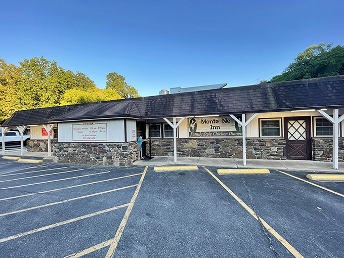 The iconic Monte Ne Inn sign promises "Family Style Chicken Dinners" with cartoon chickens that seem to know they're deliciously doomed. Arkansas comfort food at its finest.