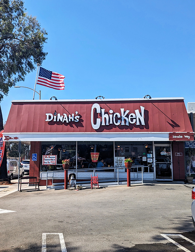 The iconic red roof of Dinah's Chicken stands like a beacon of comfort food salvation in Glendale, complete with an American flag that seems to salute your good taste.