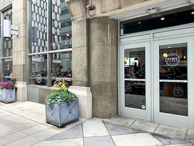 The unassuming storefront of Dime Store beckons from downtown Detroit, where flower boxes and large windows hint at the culinary treasures waiting inside.