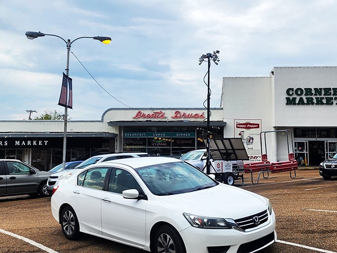 The classic storefront of Brent's Drugs beckons with its vintage neon sign, promising a taste of Mississippi nostalgia alongside your breakfast. 