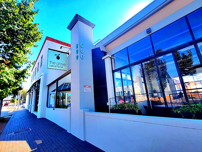 The wooden slat exterior of The Grove isn't just stylish&mdash;it's a preview of the warmth waiting inside, like a delicious secret the building can barely contain.