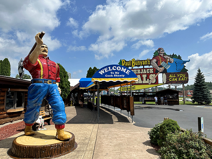 The legendary Paul Bunyan welcomes hungry travelers with a sign that practically shouts "FOOD!" louder than a lumberjack yelling "TIMBER!"