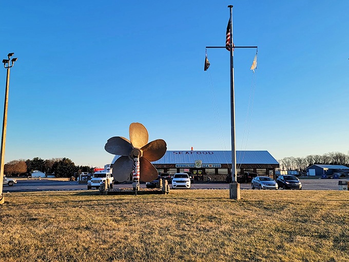 The iconic blue and white sign of Meding's stands like a maritime beacon, promising seafood treasures to those wise enough to stop.