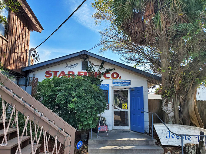 The unassuming entrance to seafood paradise – where blue doors and weathered wood promise authentic Florida flavors without an ounce of pretension.