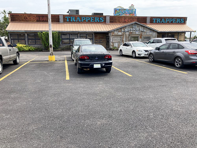 The weathered wooden exterior of Trapper's Fishcamp & Grill looks like it was teleported straight from a Louisiana bayou to Oklahoma City. Pure rustic charm!